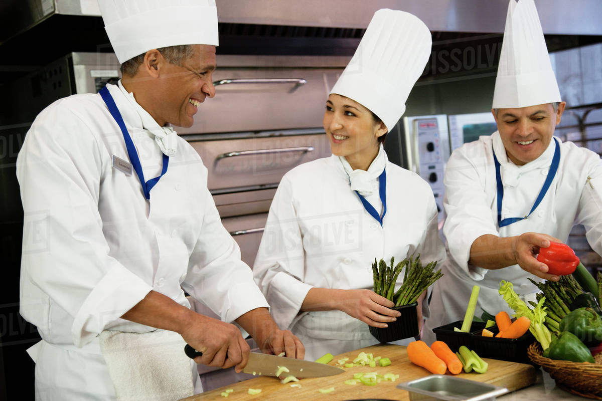 Multi-ethnic chefs preparing food - Royalty-free Stock Photo | Dissolve