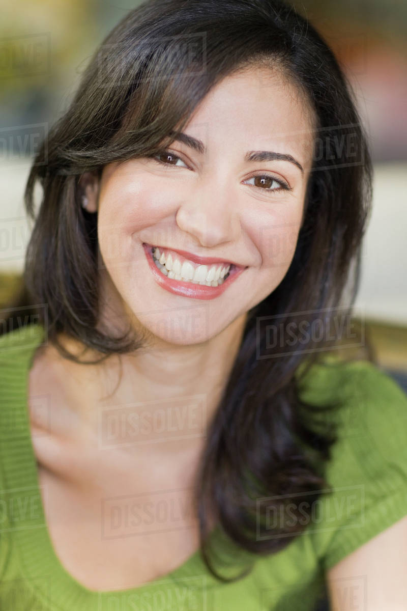 Close up of Cuban woman smiling - Stock Photo - Dissolve