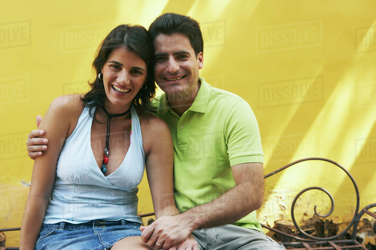 Smiling couple hugging - Stock Photo - Dissolve