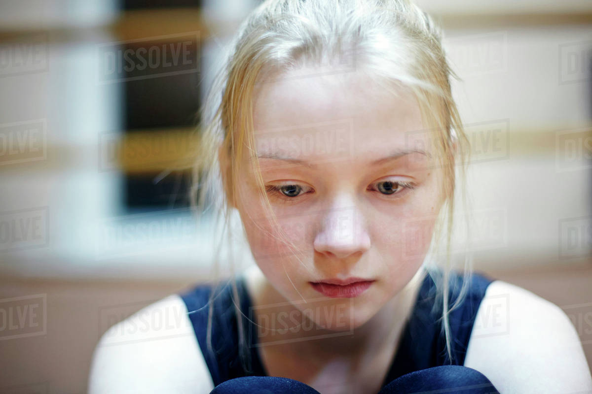 Caucasian girl looking down - Royalty-free Stock Photo | Dissolve