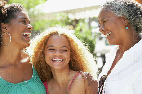 Multi-generational women laughing - Stock Photo - Dissolve