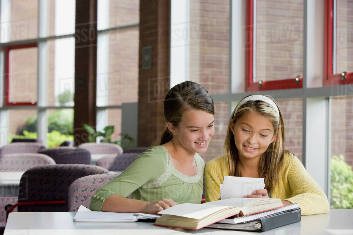 Girls doing homework - Royalty-free Stock Photo | Dissolve