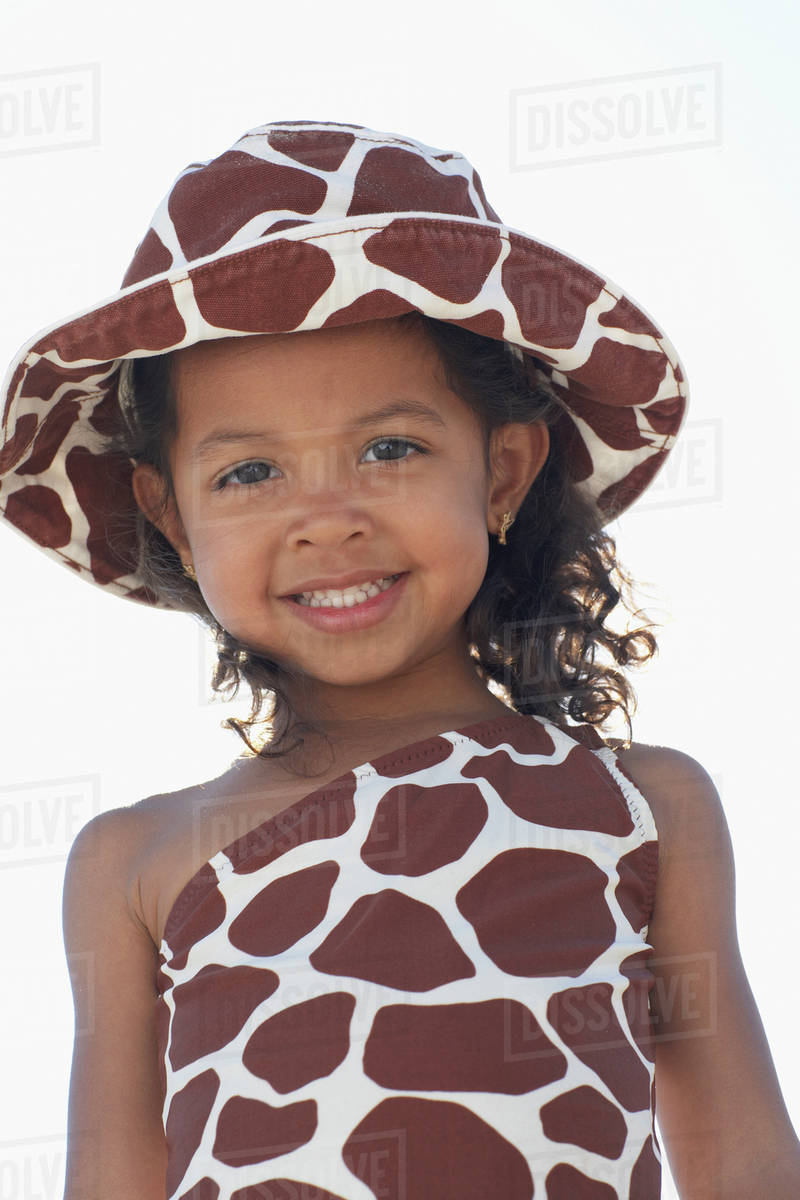 Young mixed race girl in bathing suit and hat - Royalty-free Stock ...