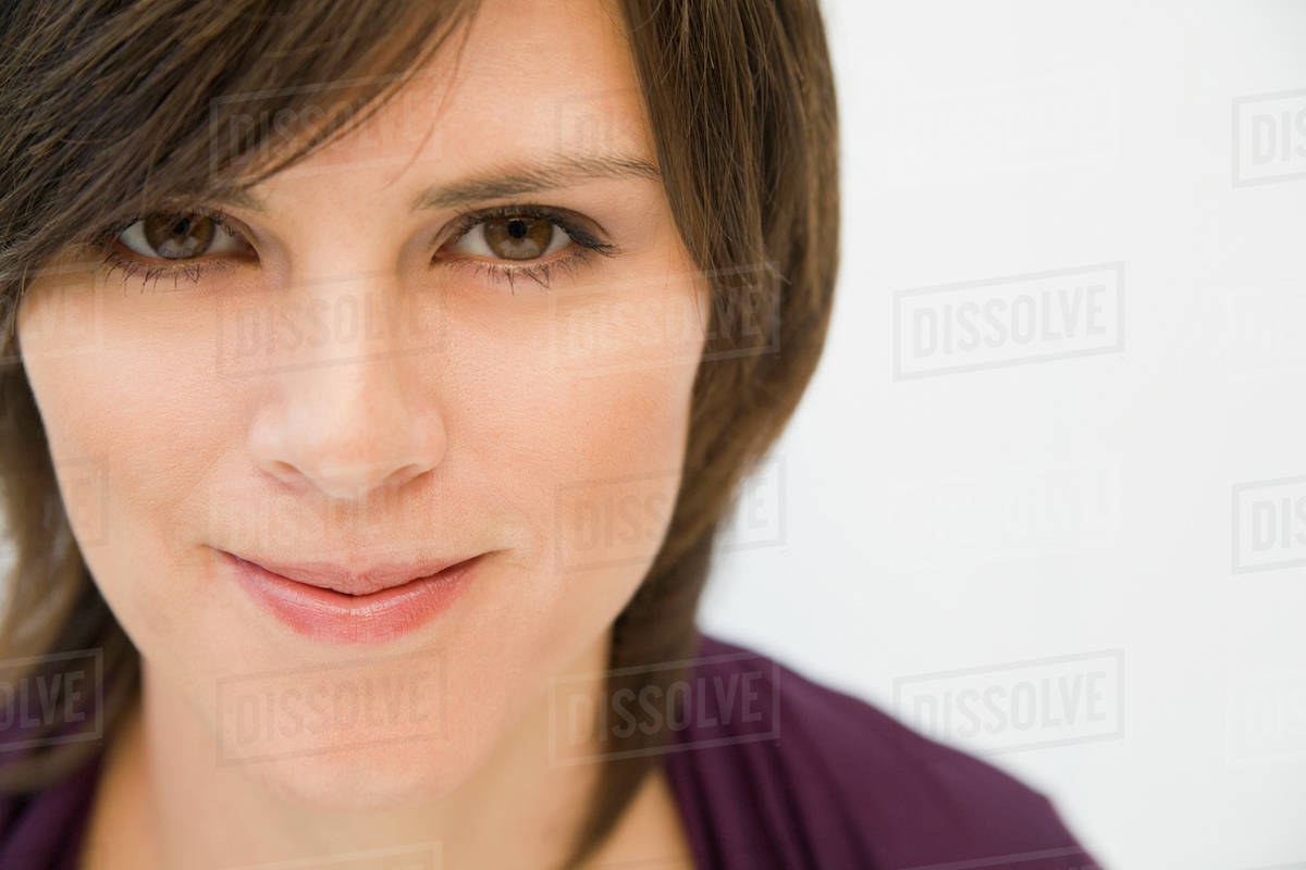Hispanic woman smiling - Stock Photo - Dissolve