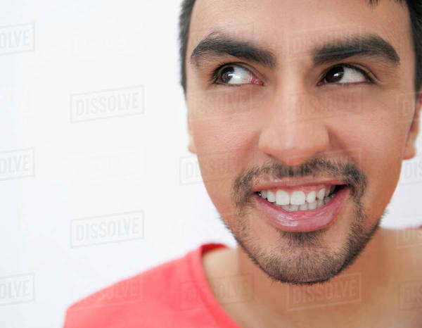 Grinning Hispanic man - Stock Photo - Dissolve