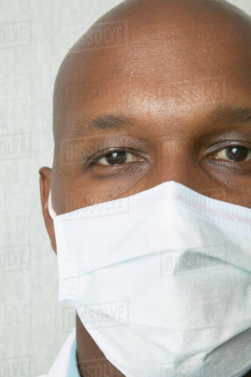 Close up of African man wearing surgical mask - Royalty-free Stock ...