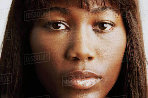 Close up of African woman's face - Stock Photo - Dissolve