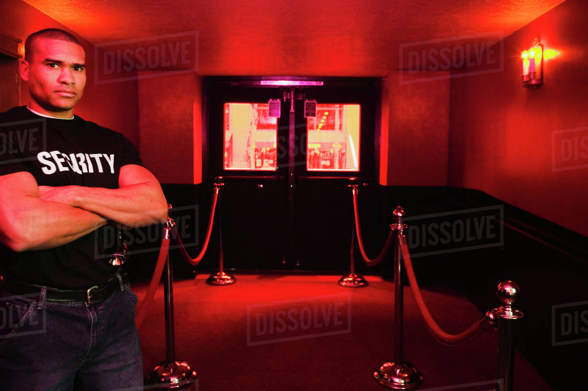 African male bouncer with arms crossed - Royalty-free Stock Photo ...