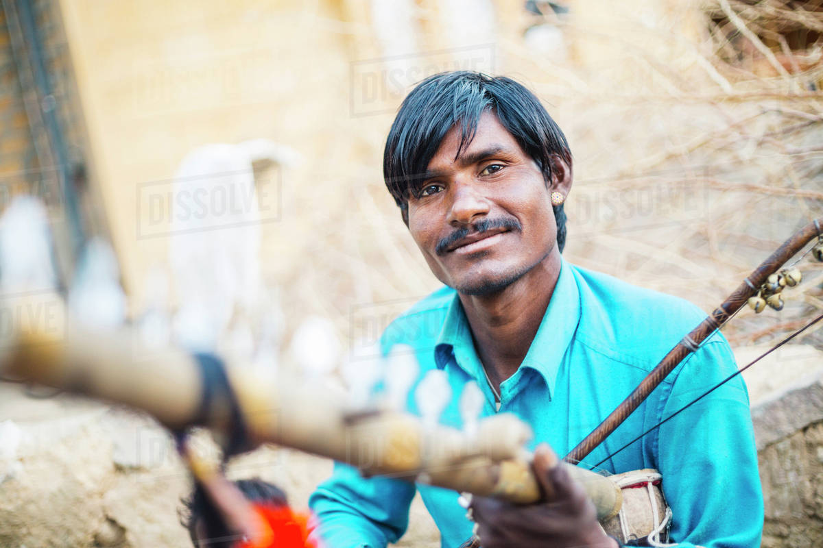 Indian man holding traditional instrument - Royalty-free Stock Photo ...
