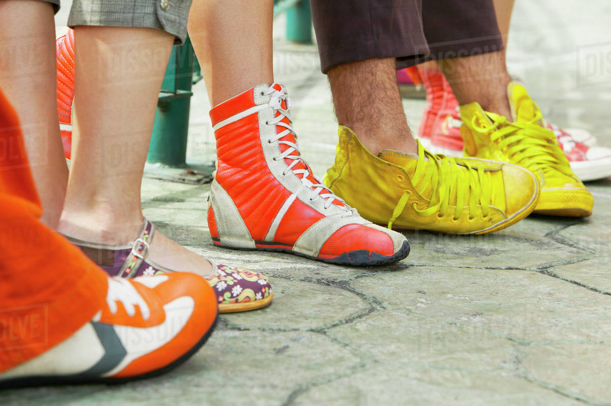 Close up of group of young people's feet with funky shoes - Stock Photo ...