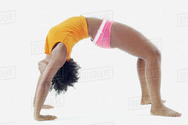 Woman in crab walk position - Royalty-free Stock Photo | Dissolve