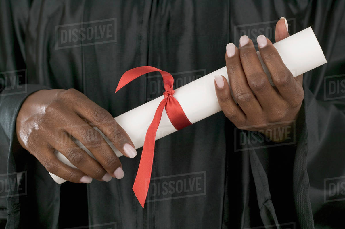 Hands holding diploma - Stock Photo - Dissolve