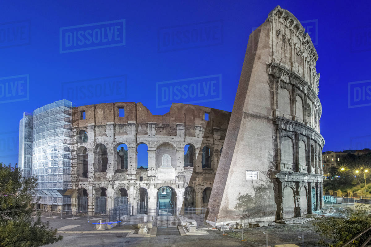 Coliseum ruins illuminated at night, Rome, Italy - Stock Photo - Dissolve
