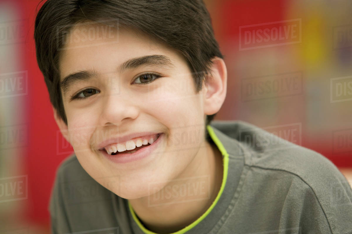Portrait of Hispanic boy smiling - Stock Photo - Dissolve