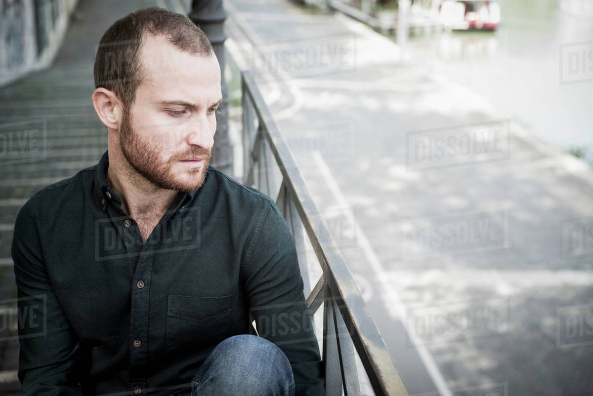 Caucasian man sitting on outdoor staircase - Royalty-free Stock Photo ...