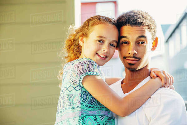 Mixed race brother holding sister outdoors - Royalty-free Stock Photo ...