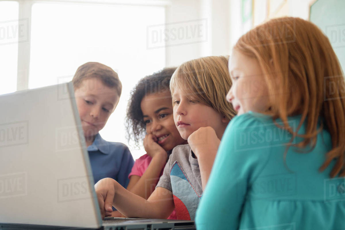 Students using laptop in classroom - Royalty-free Stock Photo | Dissolve