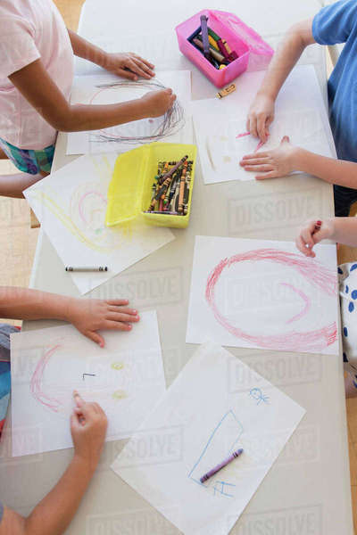Students drawing in classroom - Stock Photo - Dissolve