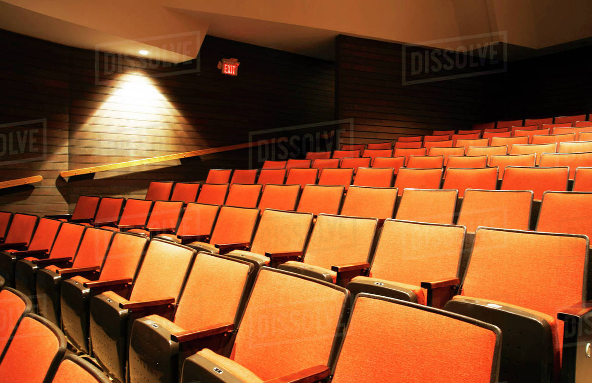 Empty chairs in movie theater - Royalty-free Stock Photo | Dissolve