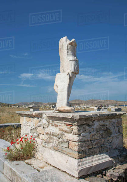 Statue ruins on stone pedestal - Stock Photo - Dissolve