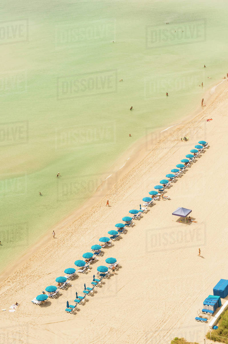 Aerial view of lawn chairs on beach - Royalty-free Stock Photo | Dissolve