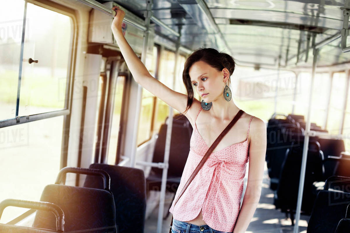 Caucasian woman riding bus - Royalty-free Stock Photo | Dissolve