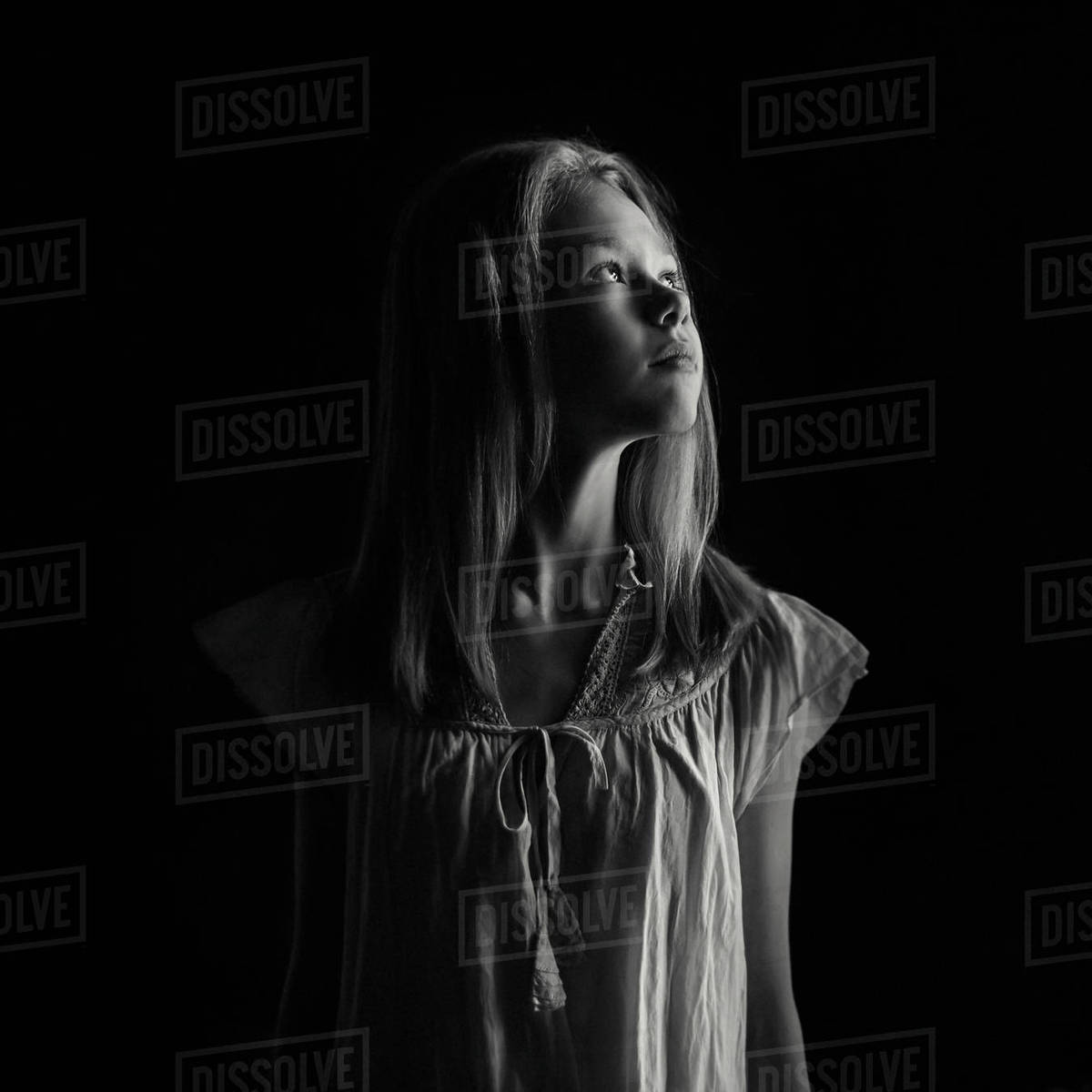Caucasian teenage girl looking up - Royalty-free Stock Photo | Dissolve
