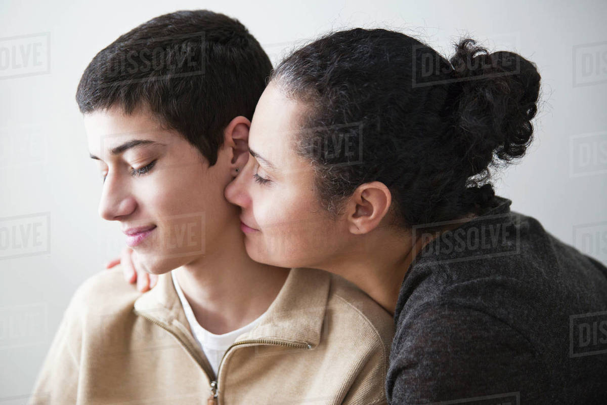 Close up of mother hugging son - Royalty-free Stock Photo | Dissolve