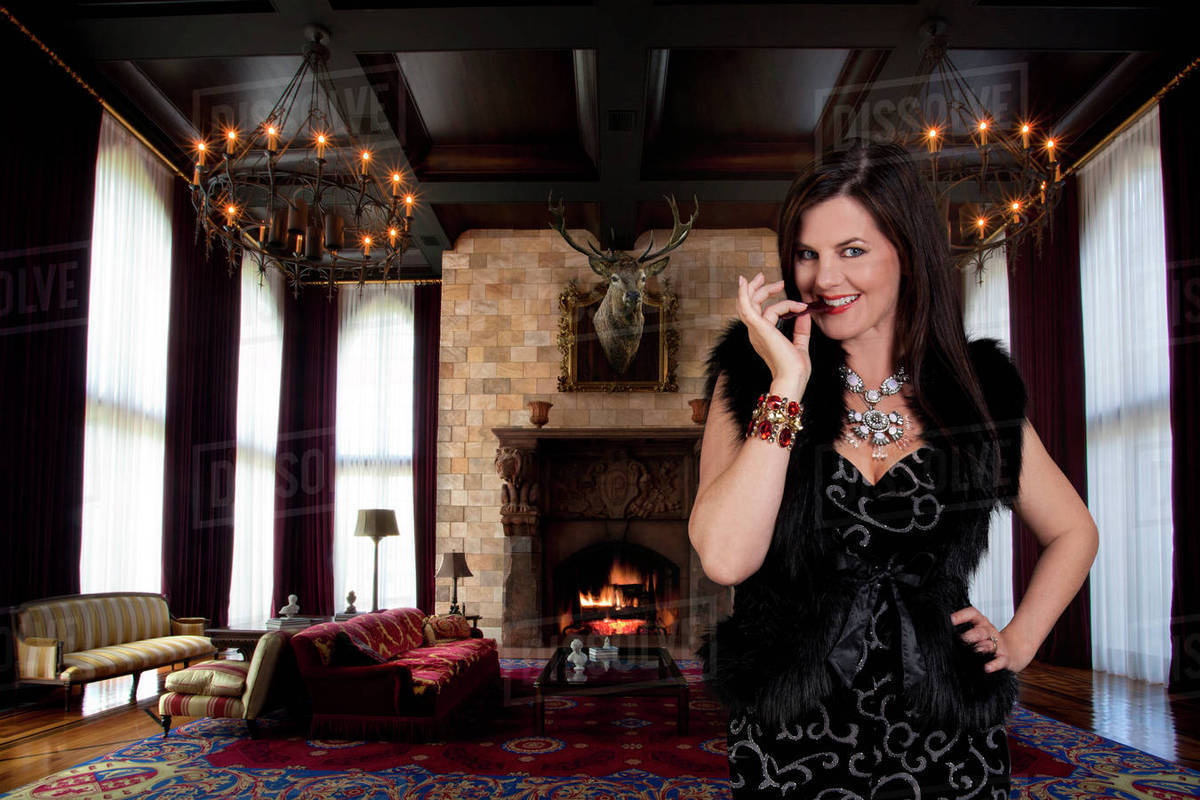 Caucasian woman eating beef in ornate sitting room - Royalty-free Stock ...