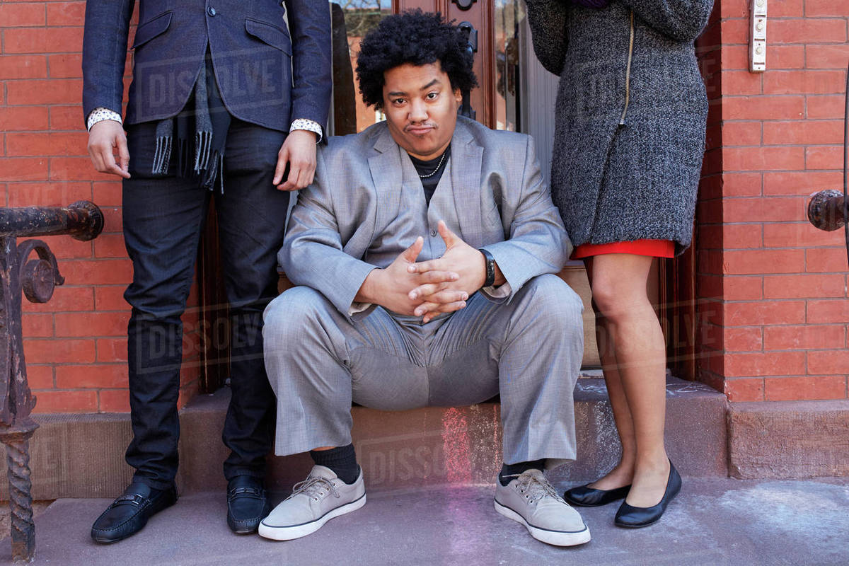 Man making a face on front stoop - Royalty-free Stock Photo | Dissolve