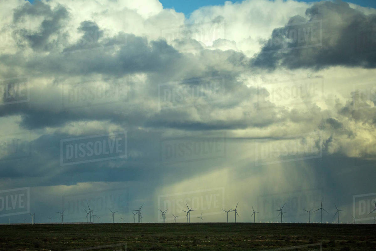 Storm clouds over wind turbines in rural landscape - Royalty-free Stock ...