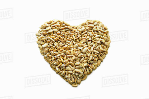 Heart-healthy seeds in heart-shape - Stock Photo - Dissolve