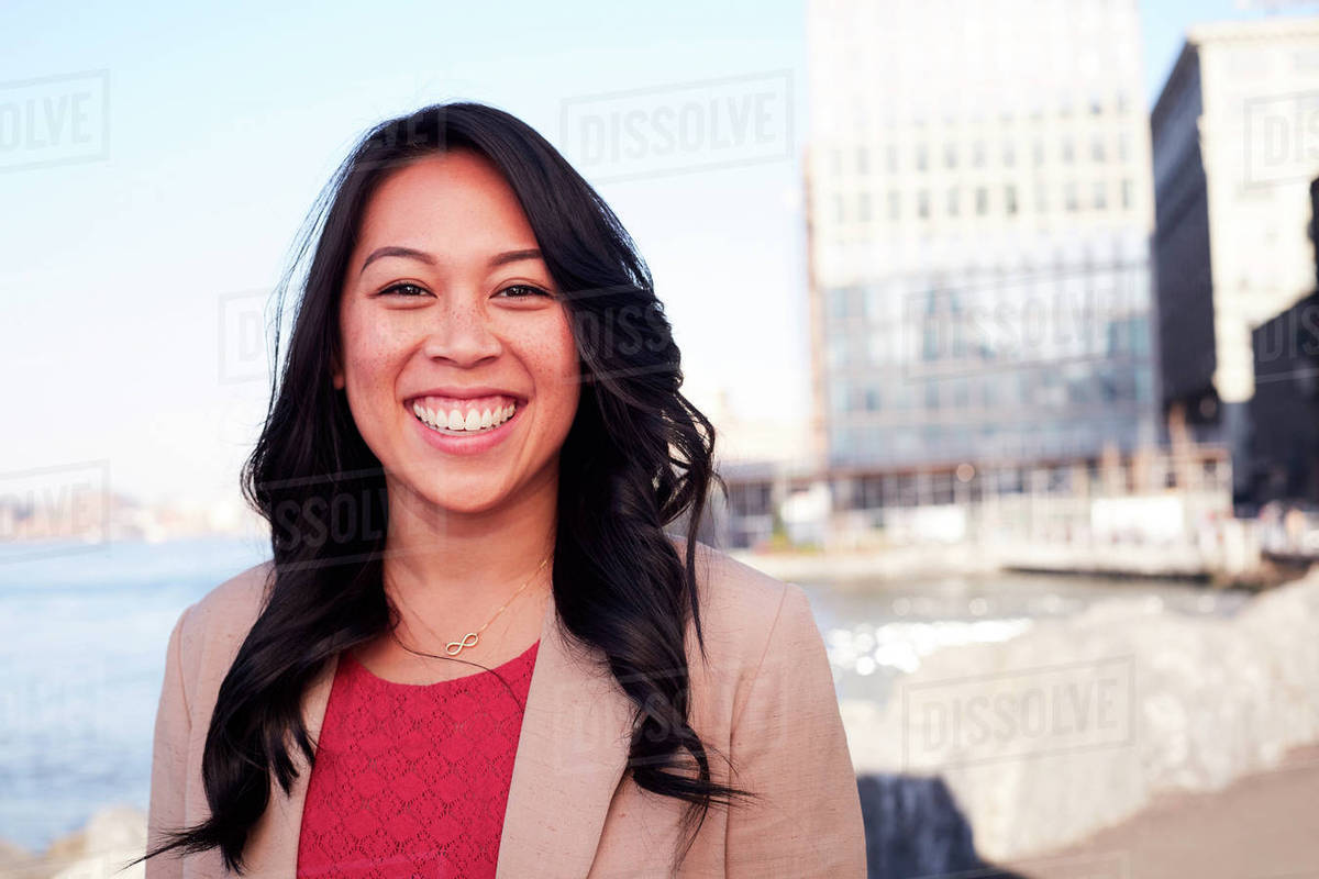 Pacific Islander woman smiling at waterfront - Royalty-free Stock Photo ...
