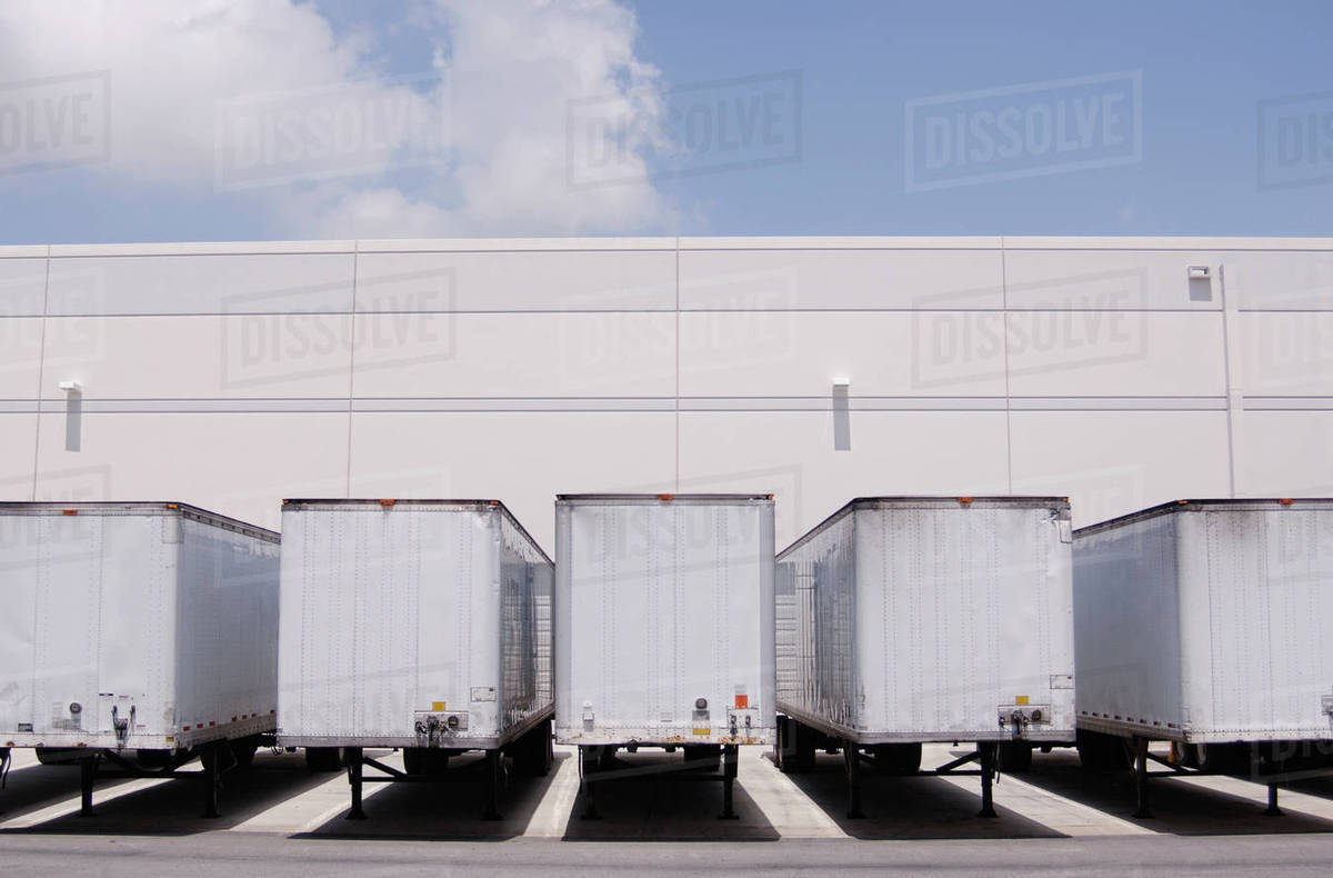 Cargo containers at loading docks - Royalty-free Stock Photo | Dissolve