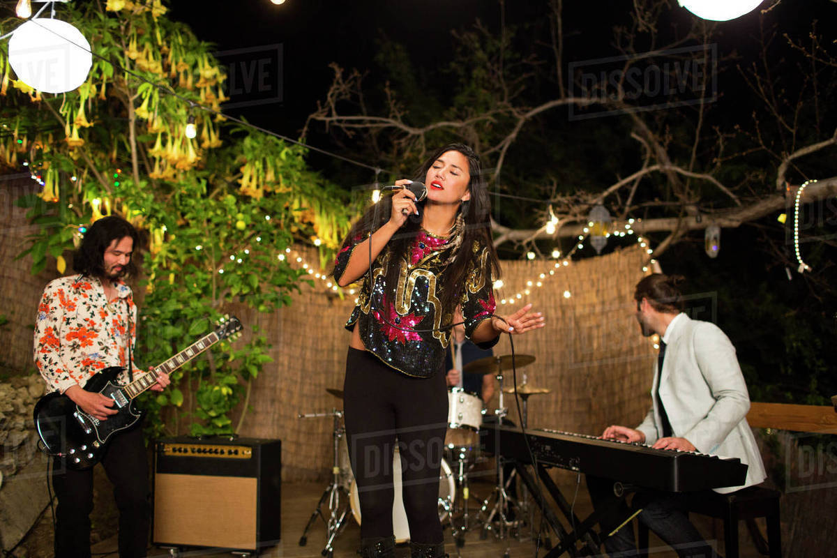 Band performing music on stage - Royalty-free Stock Photo | Dissolve