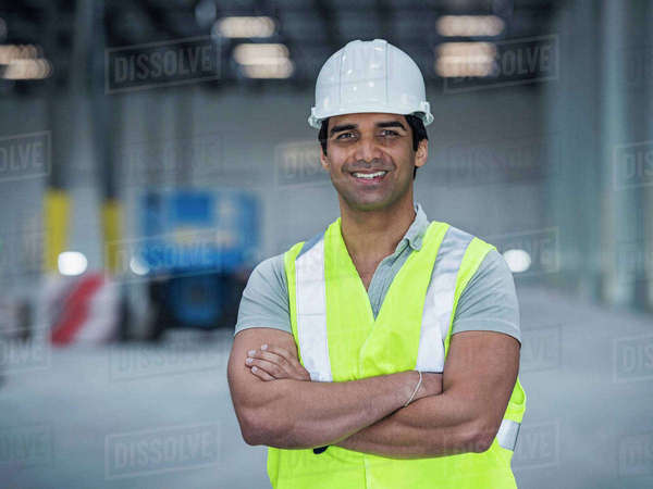 Smiling indian worker in warehouse - Royalty-free Stock Photo | Dissolve