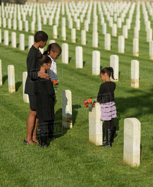 Black family at military cemetery - Stock Photo - Dissolve