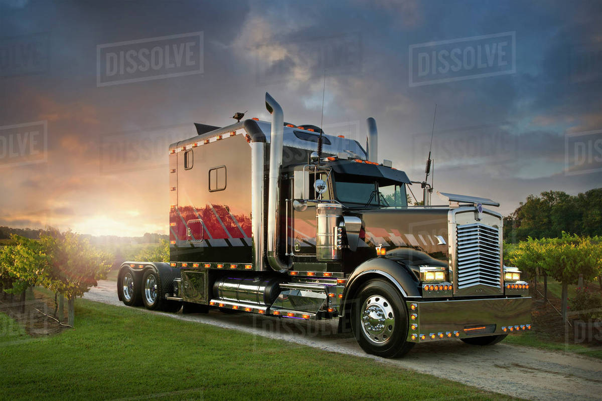 Semi-truck driving on rural road - Royalty-free Stock Photo | Dissolve