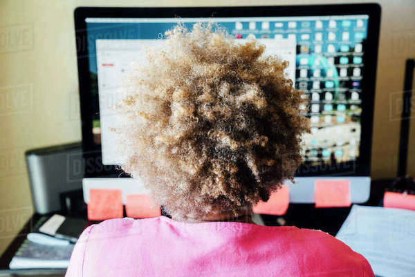 Black woman using computer - Royalty-free Stock Photo | Dissolve