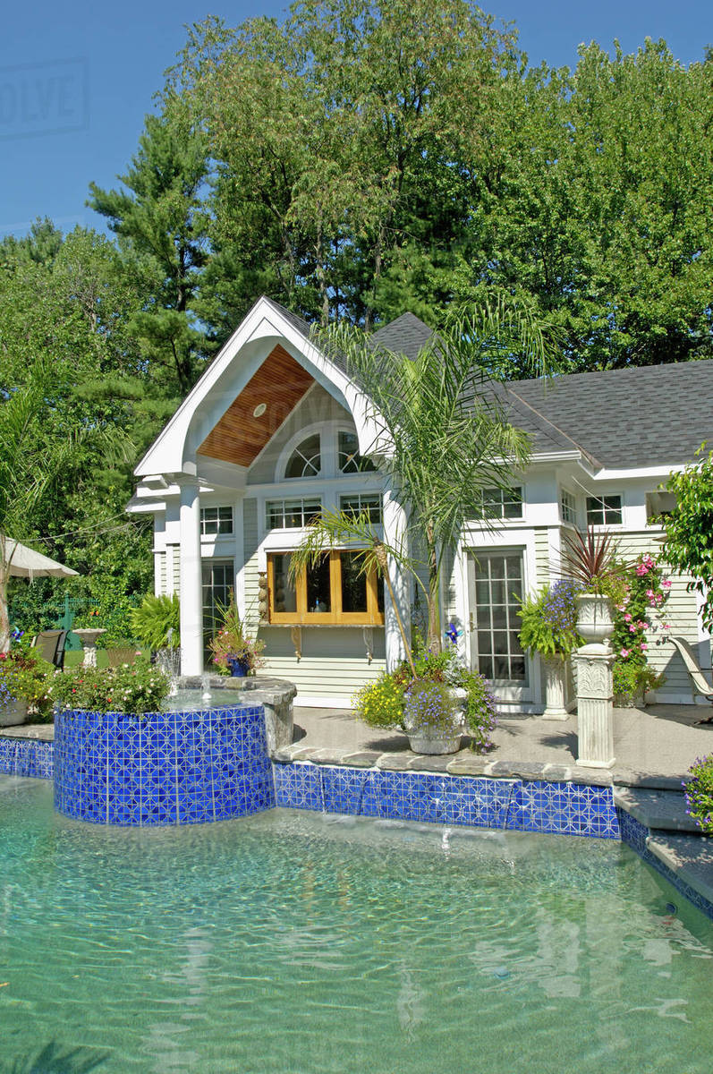 Swimming pool in front of pool house - Royalty-free Stock Photo | Dissolve