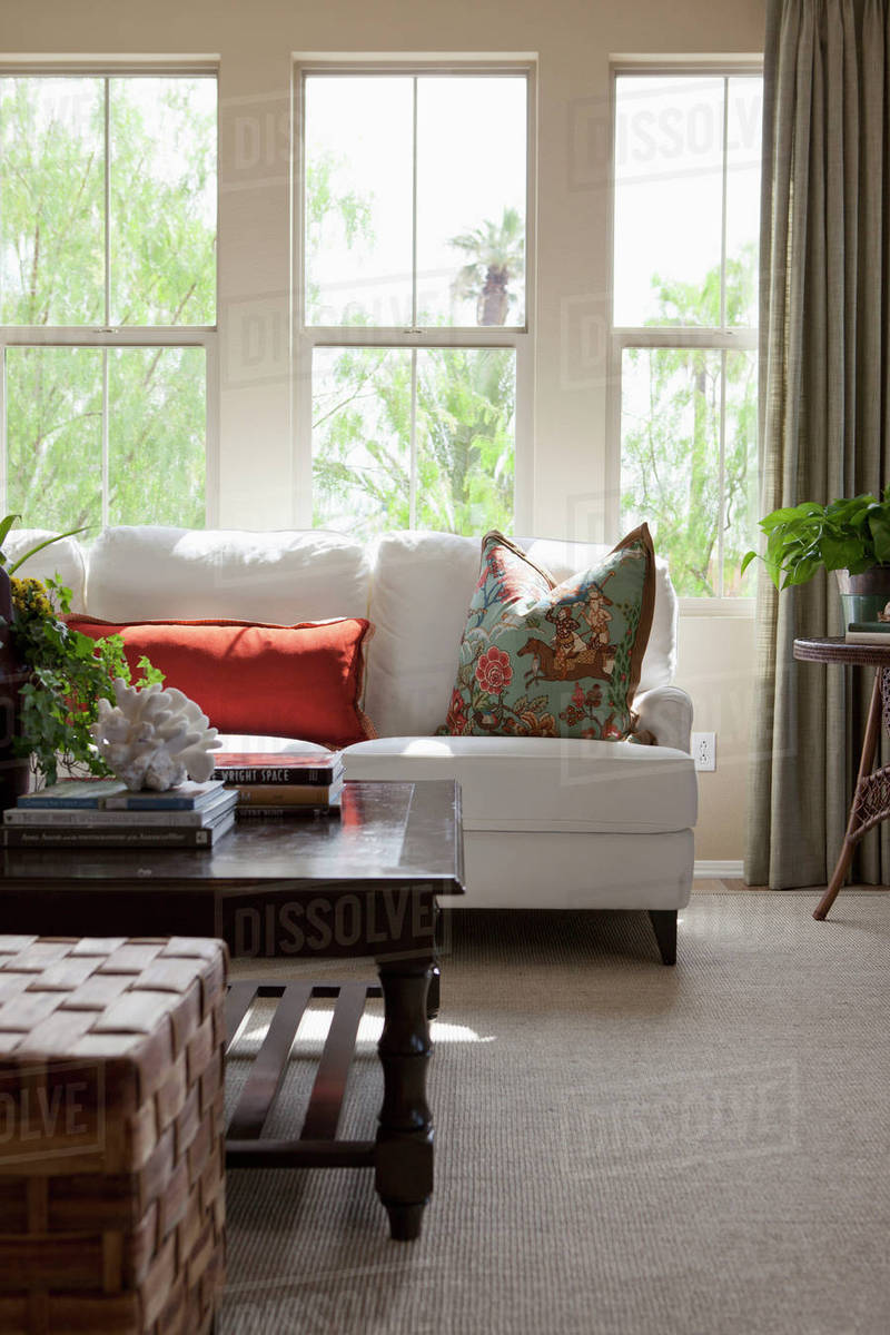 Couch with coffee table against window in the living room at home ...