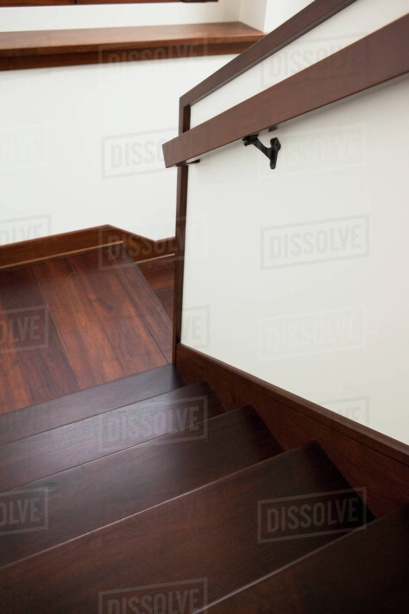 High angle view of wooden stairs with handrail at home - Stock Photo ...