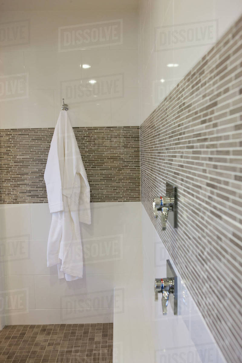 Bathrobe hanging in domestic bathroom - Royalty-free Stock Photo | Dissolve