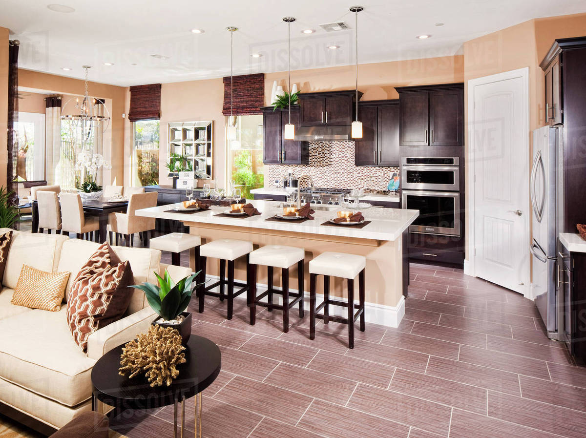 Open plan kitchen with breakfast bar - Stock Photo - Dissolve