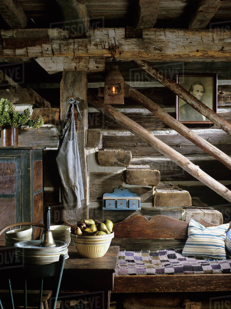 Rustic stairs descending into kitchen area in restored log home, rustic ...