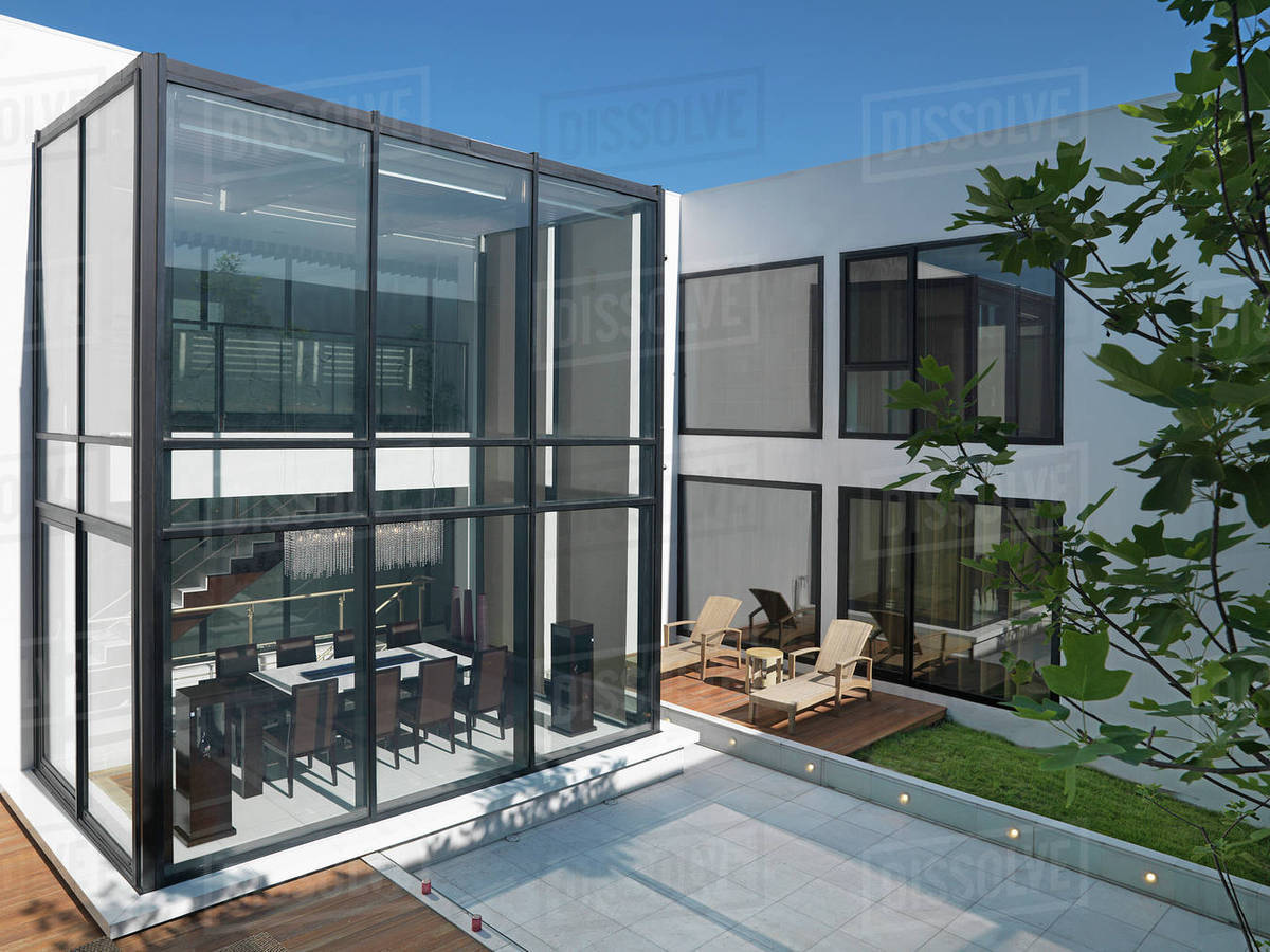 Exterior of modern glass home - Royalty-free Stock Photo | Dissolve