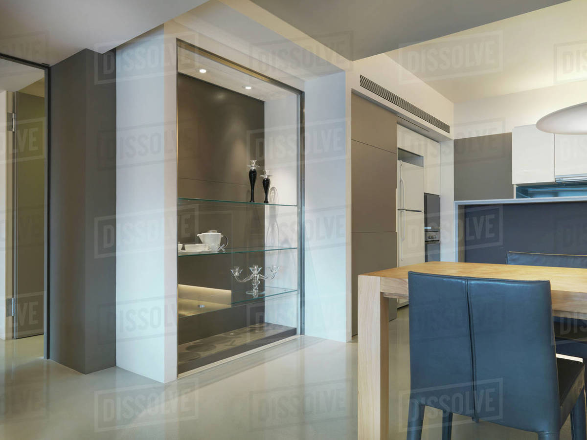 Dining tables and display shelves in modern home - Royalty-free Stock ...