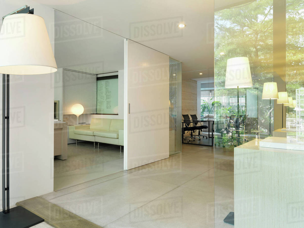 Sliding doors to private office in modern office building - Stock Photo ...
