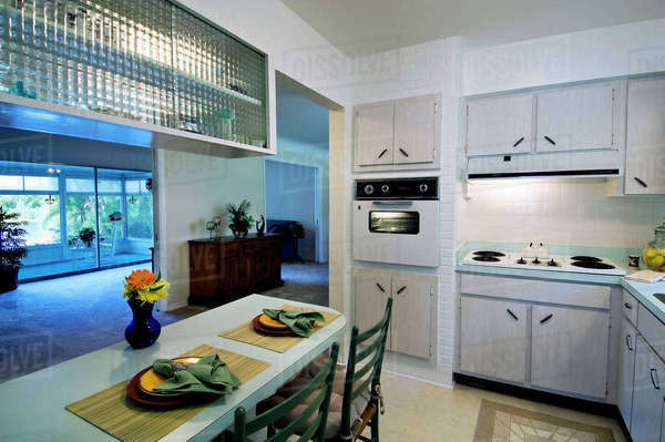 Place settings at breakfast bar in retro kitchen - Royalty-free Stock ...