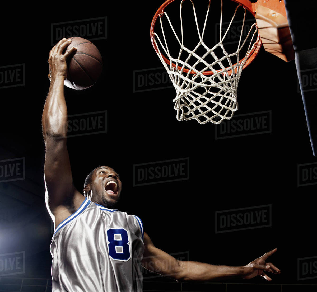 African basketball player scoring - Royalty-free Stock Photo | Dissolve